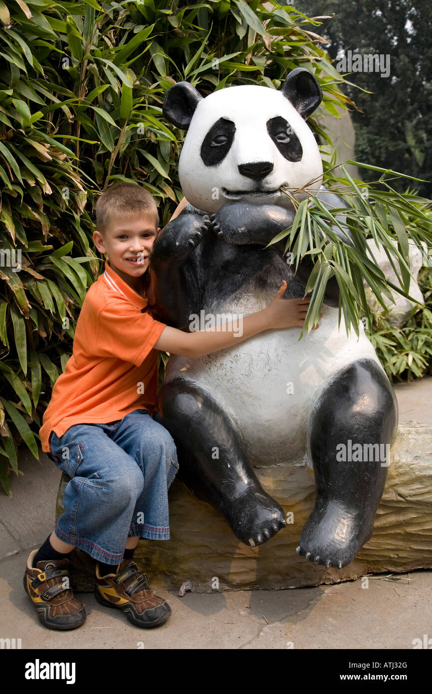 Boy with Giant panda in the Beijing Zoo Stock Photo - Alamy
