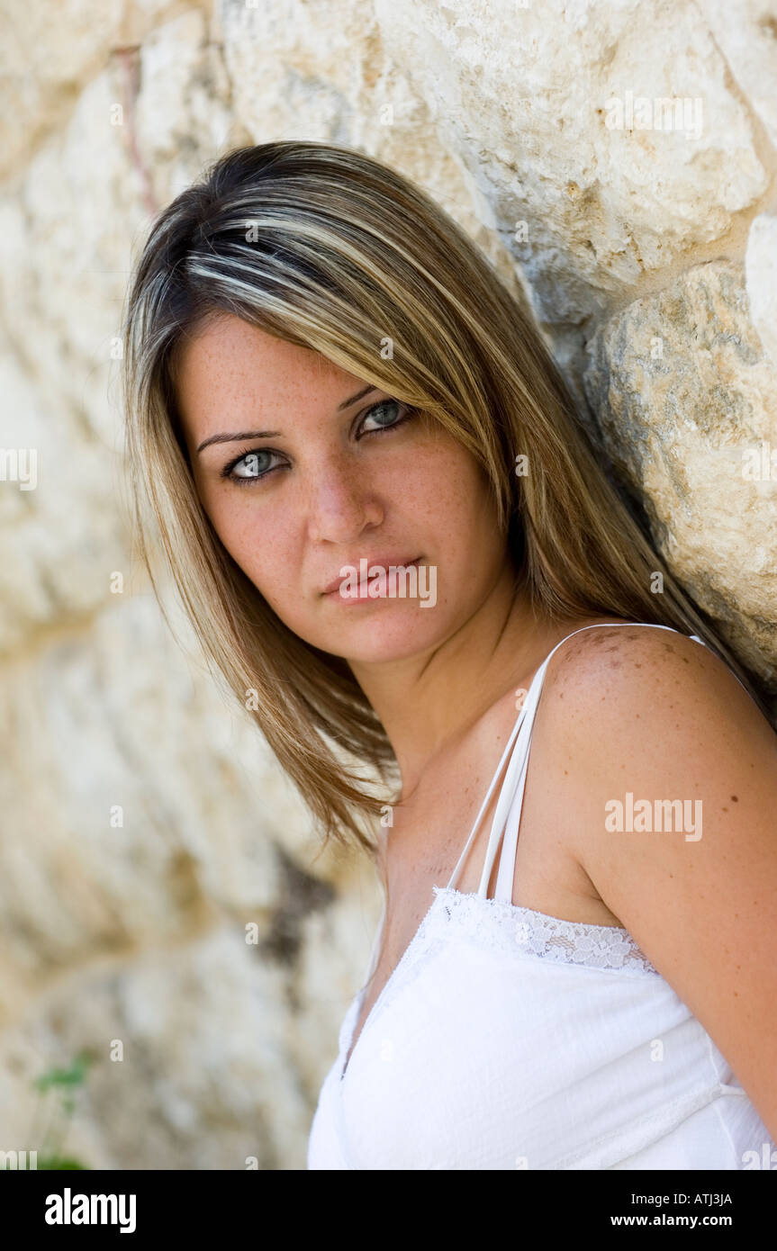 Beautiful female against the wall Stock Photo - Alamy