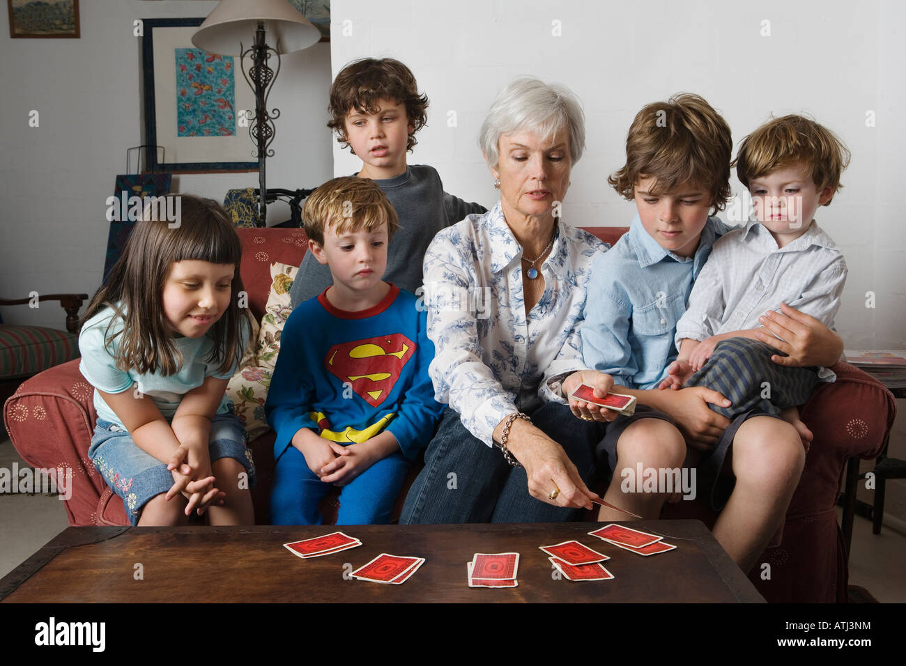 grandmother playing cards with her grandchildren Stock Photo - Alamy