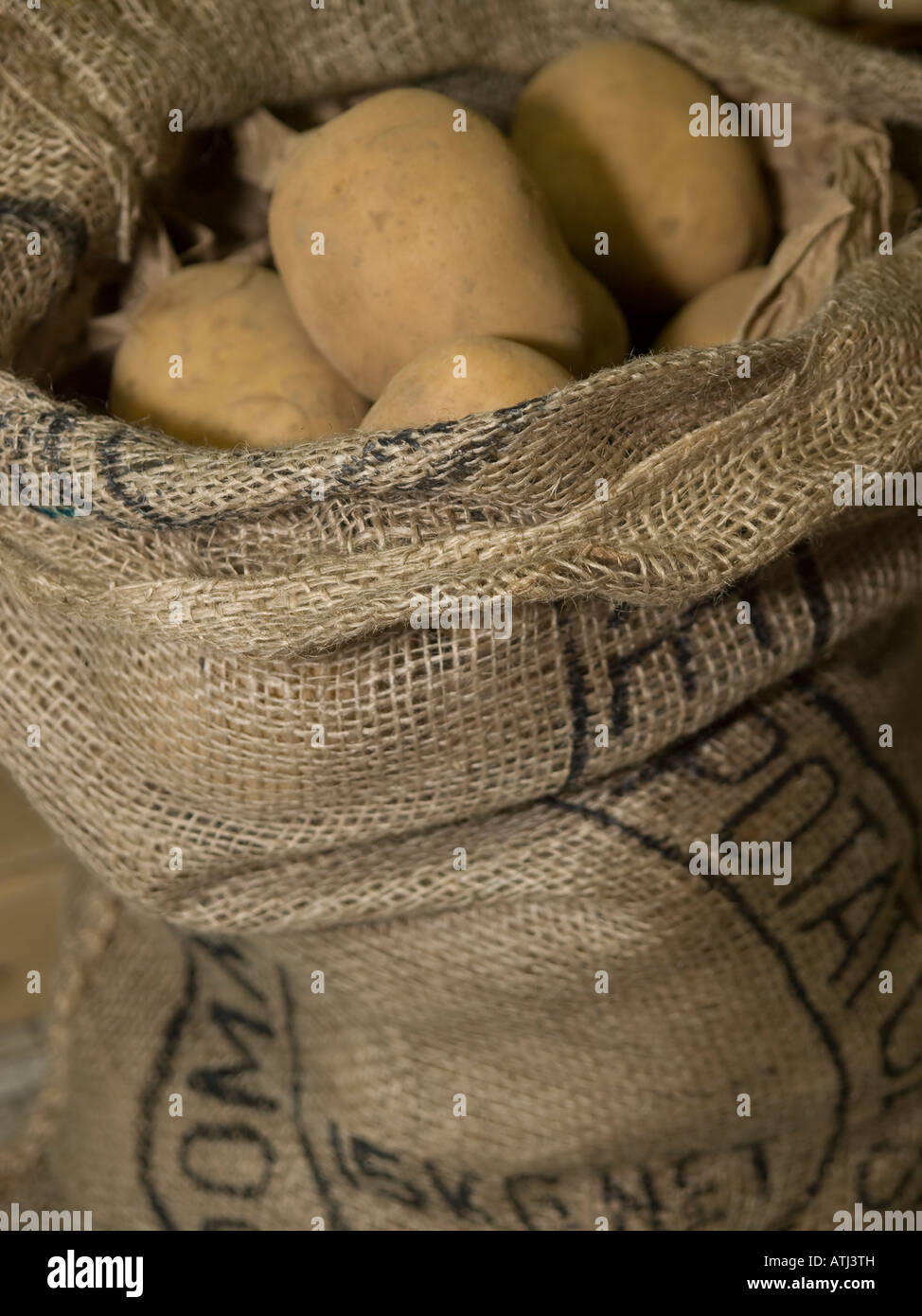 burlap sack bag filled with potatoes Stock Photo - Alamy