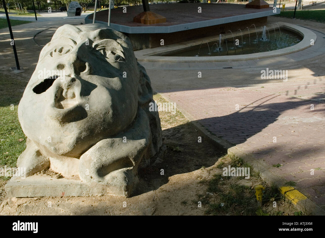 Stone statues of smiling faces in the Peace Park, Zaragoza, Aragon ...