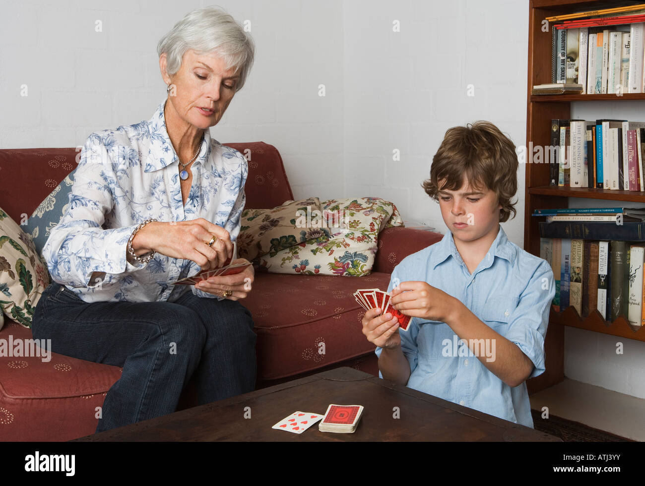 grandmother playing cards with grandson Stock Photo - Alamy