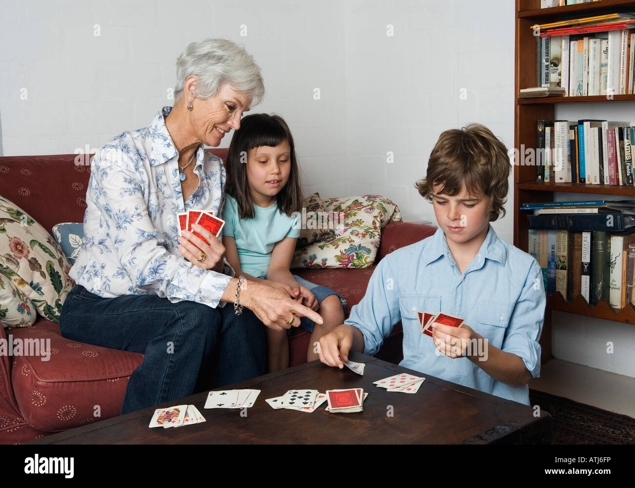 grandmother playing cards with grandchildren Stock Photo - Alamy