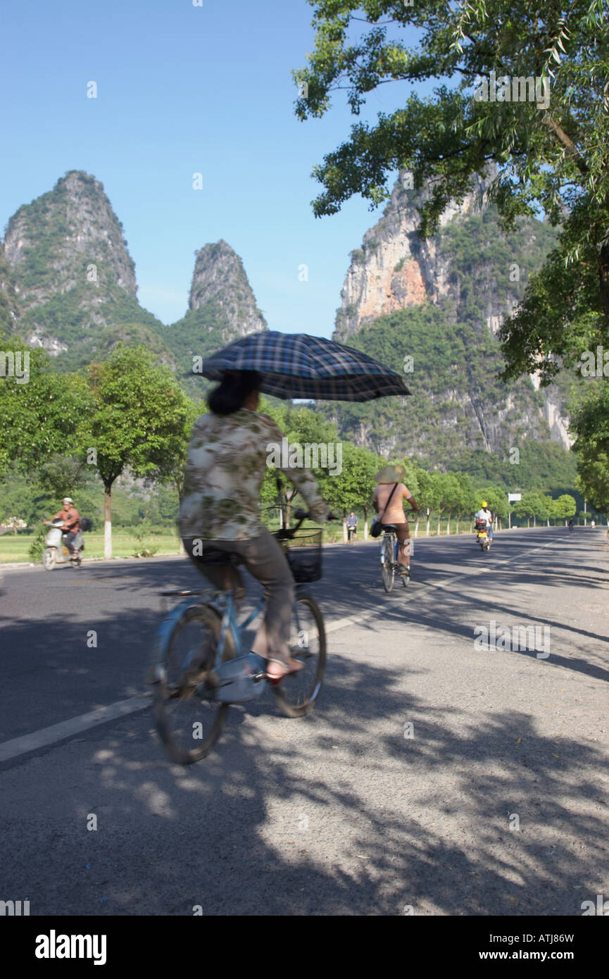 Chinese women riding bicycle hi-res stock photography and images - Alamy