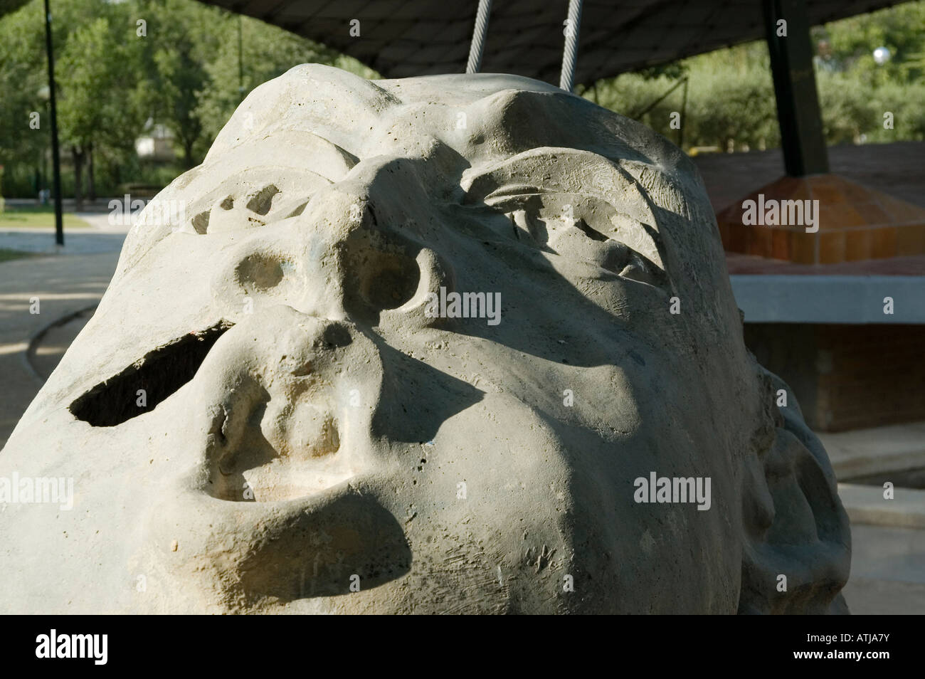 Stone statues of smiling faces in the Peace Park, Zaragoza, Aragon ...
