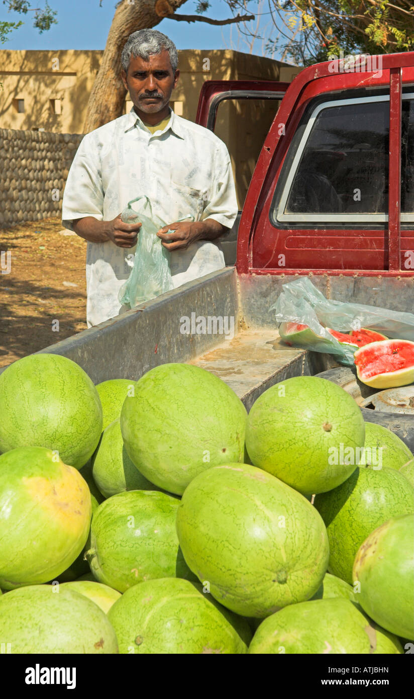 Man selling watermelons back of truck in Sur Oman Stock Photo - Alamy