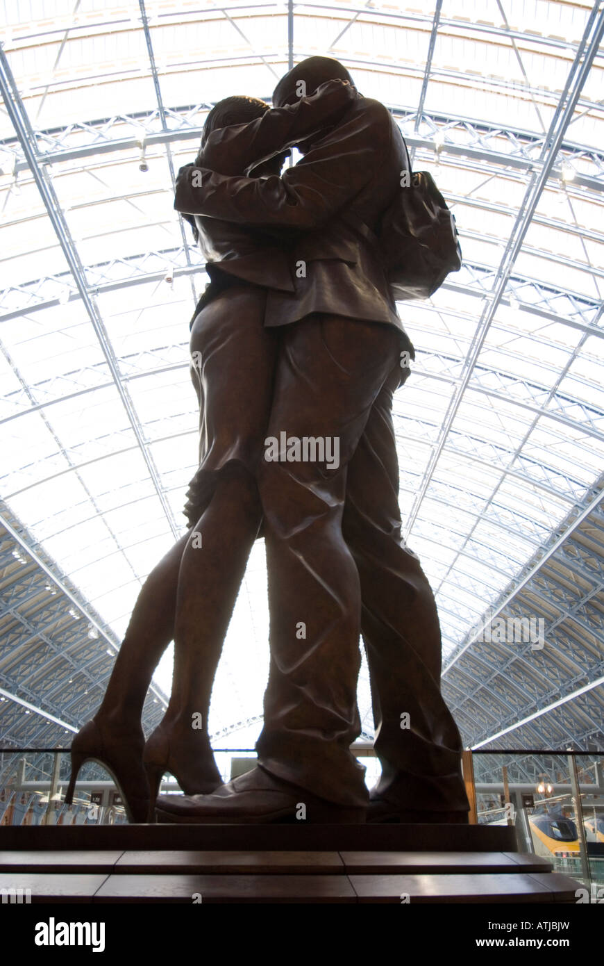 Bronze statue The Meeting Place in St Pancras train station London ...