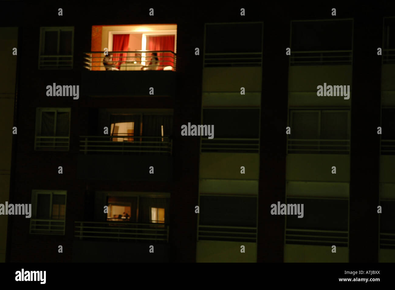 a couple dining in a building terrace at night Stock Photo - Alamy