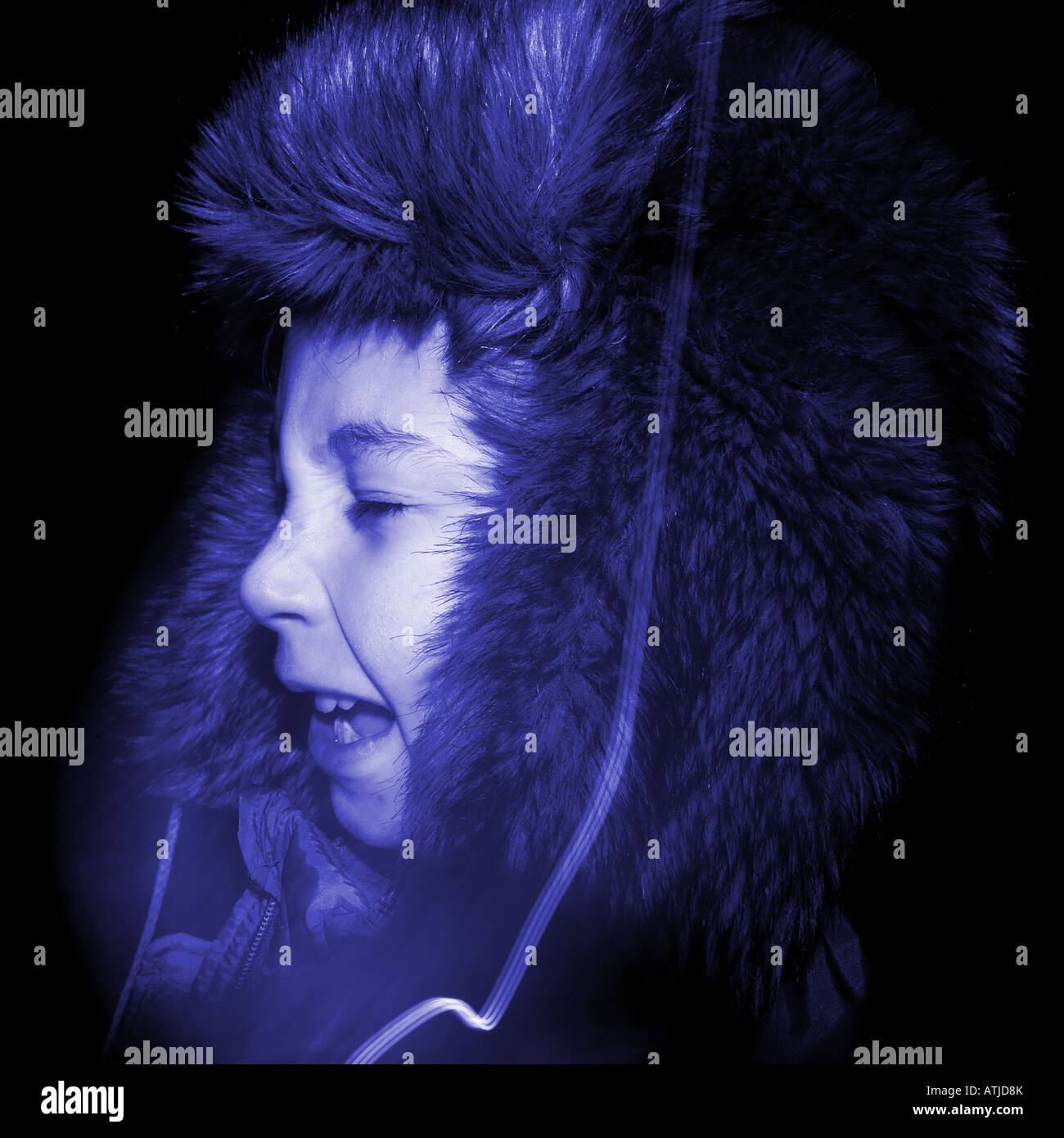 kid screaming toned in blue (winter sports Stock Photo - Alamy