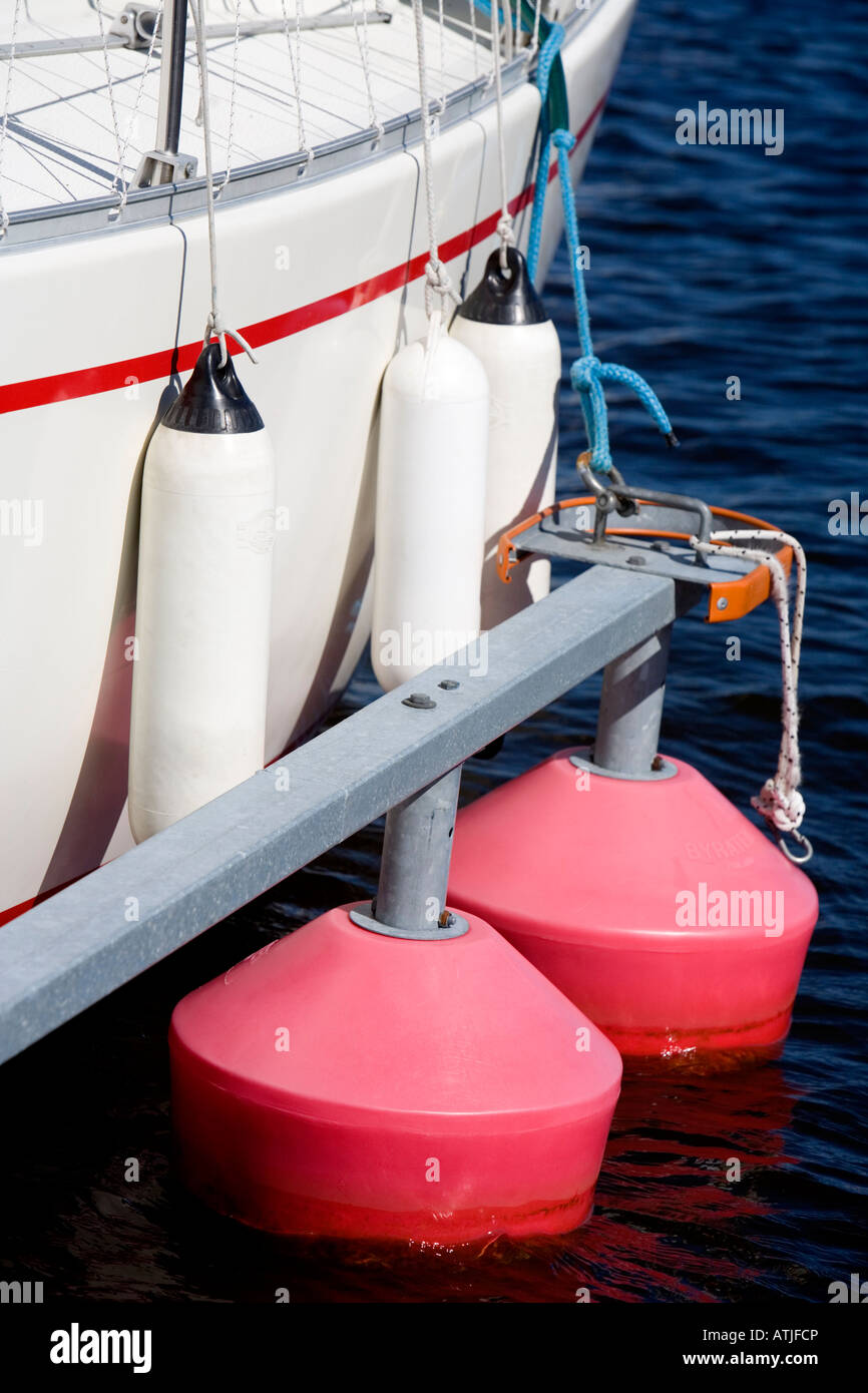 Yacht fenders protecting the hull of a moored sailing ship , Finland ...