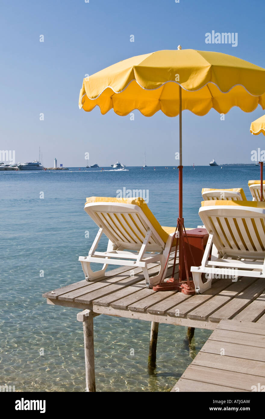 Mediterranean sea French Riviera tanning beds and beach umbrellas Stock ...