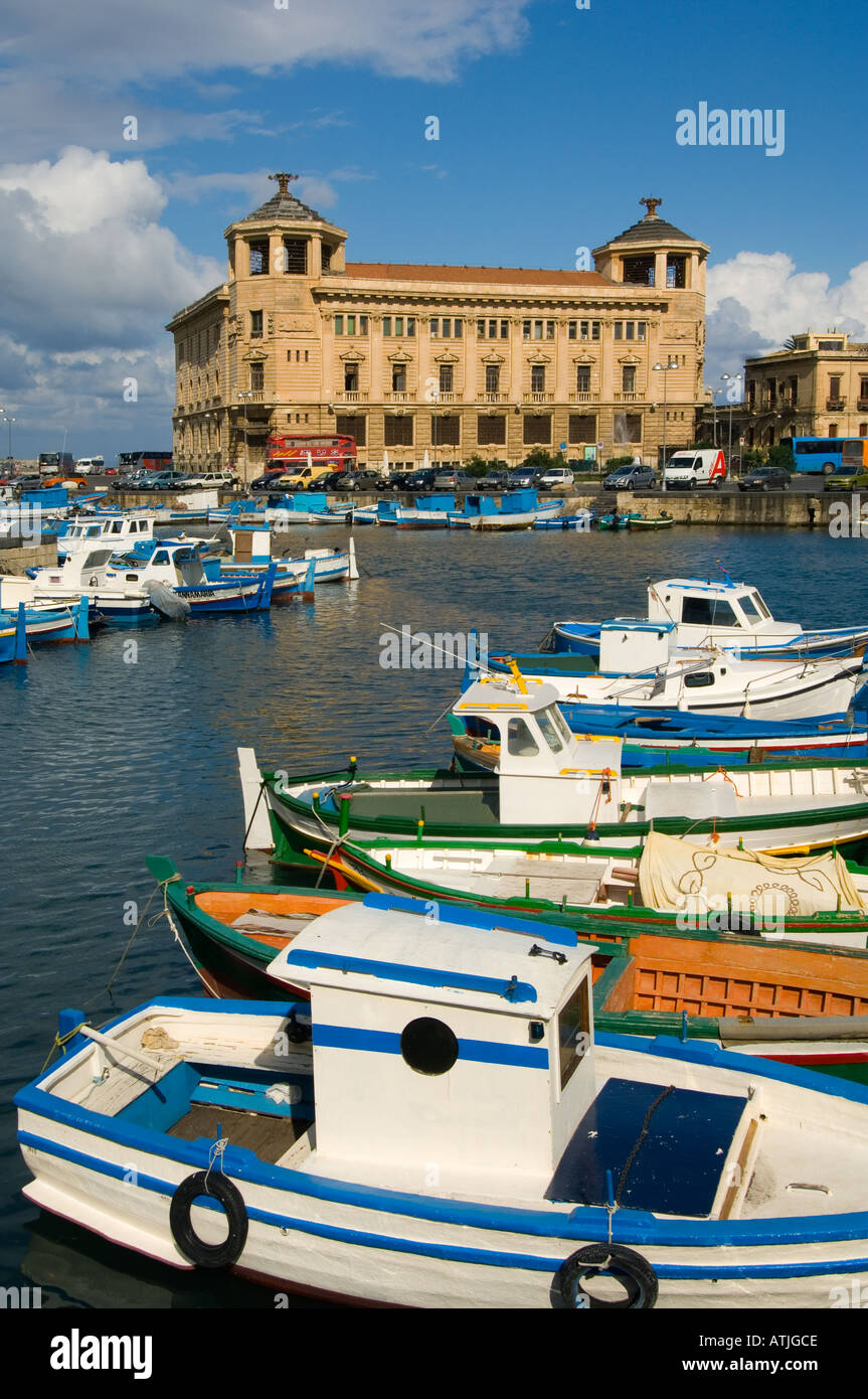 Little boats in a sheltered harbour with the ornate post office ...