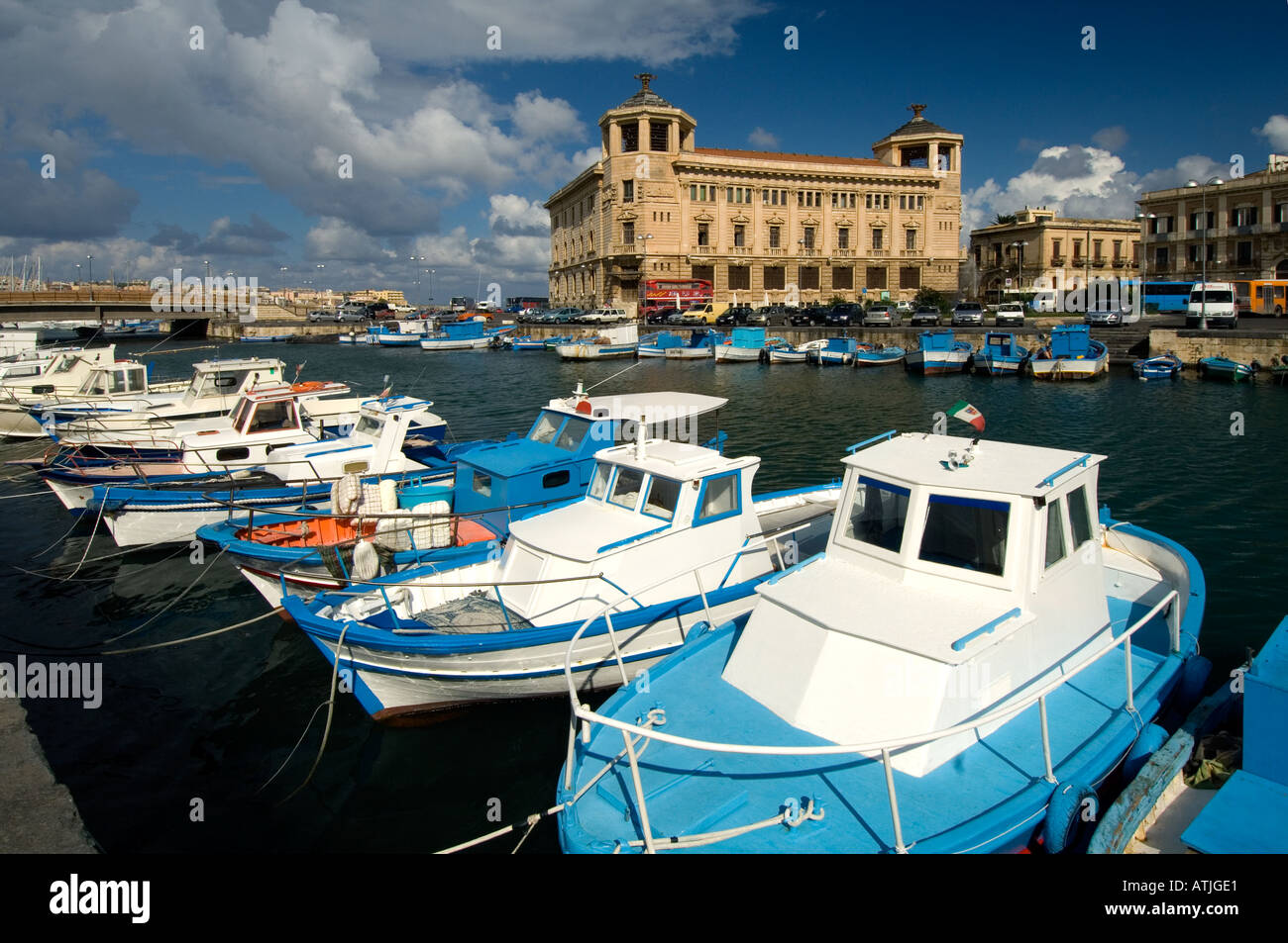 Little boats in a sheltered harbour with the ornate post office ...