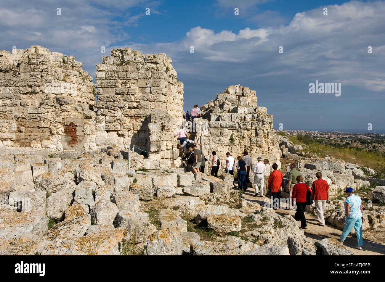 Tourists in the ruins of the ancient Greek fort of Castello Eurialo on ...