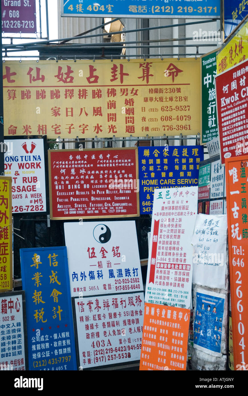 Various Chinese signs on a wall in Chinatown, New York City Stock Photo ...