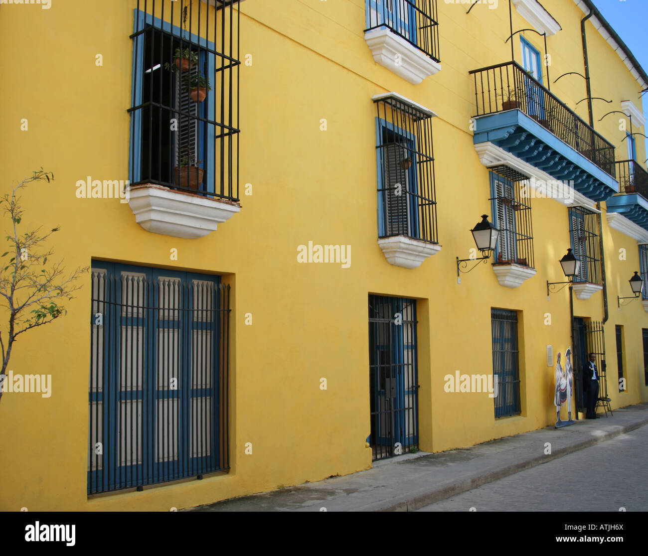 Yellow wall building with blue doors and windows in Havana Cuba Stock ...