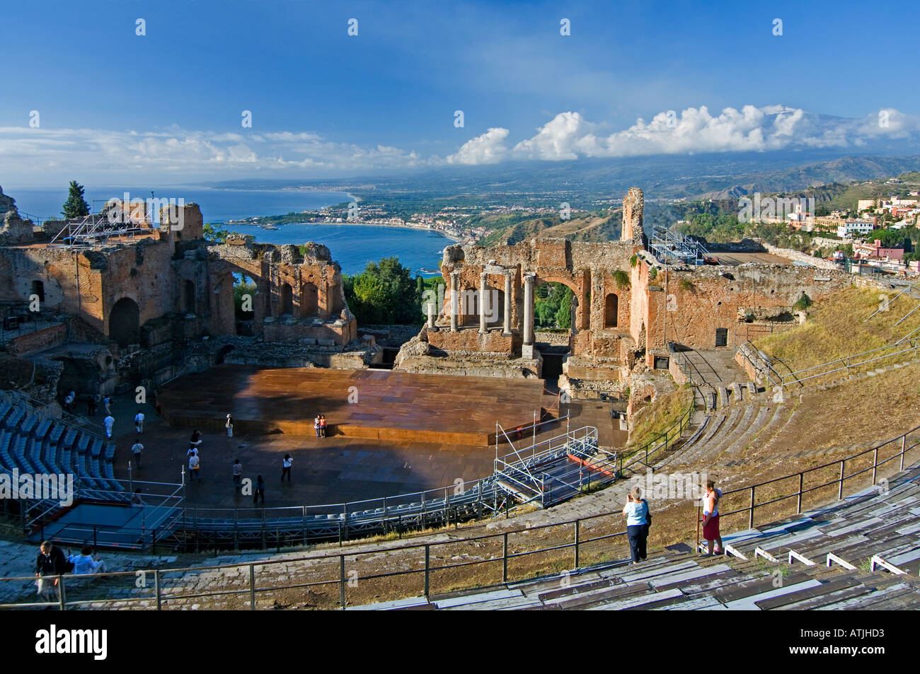 The Greek amphitheatre in Taormina Sicily with the coast of Naxos and ...