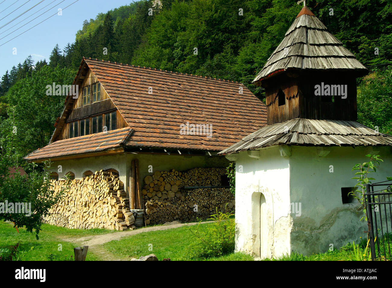 Traditional Slovak house, with wooden fuel ready for winter season ...