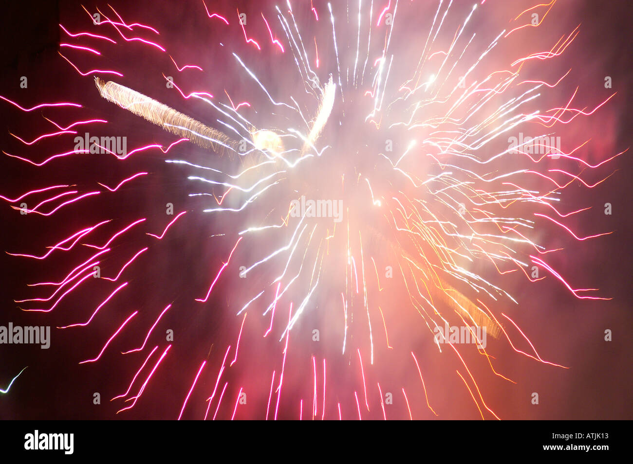 Pink fireworks mid air explosion Stock Photo - Alamy