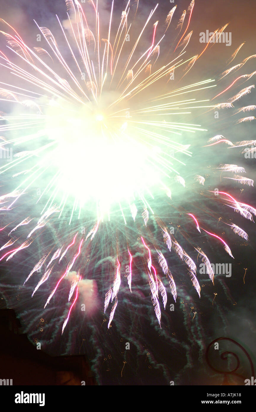 Pink fireworks mid air explosion Stock Photo - Alamy