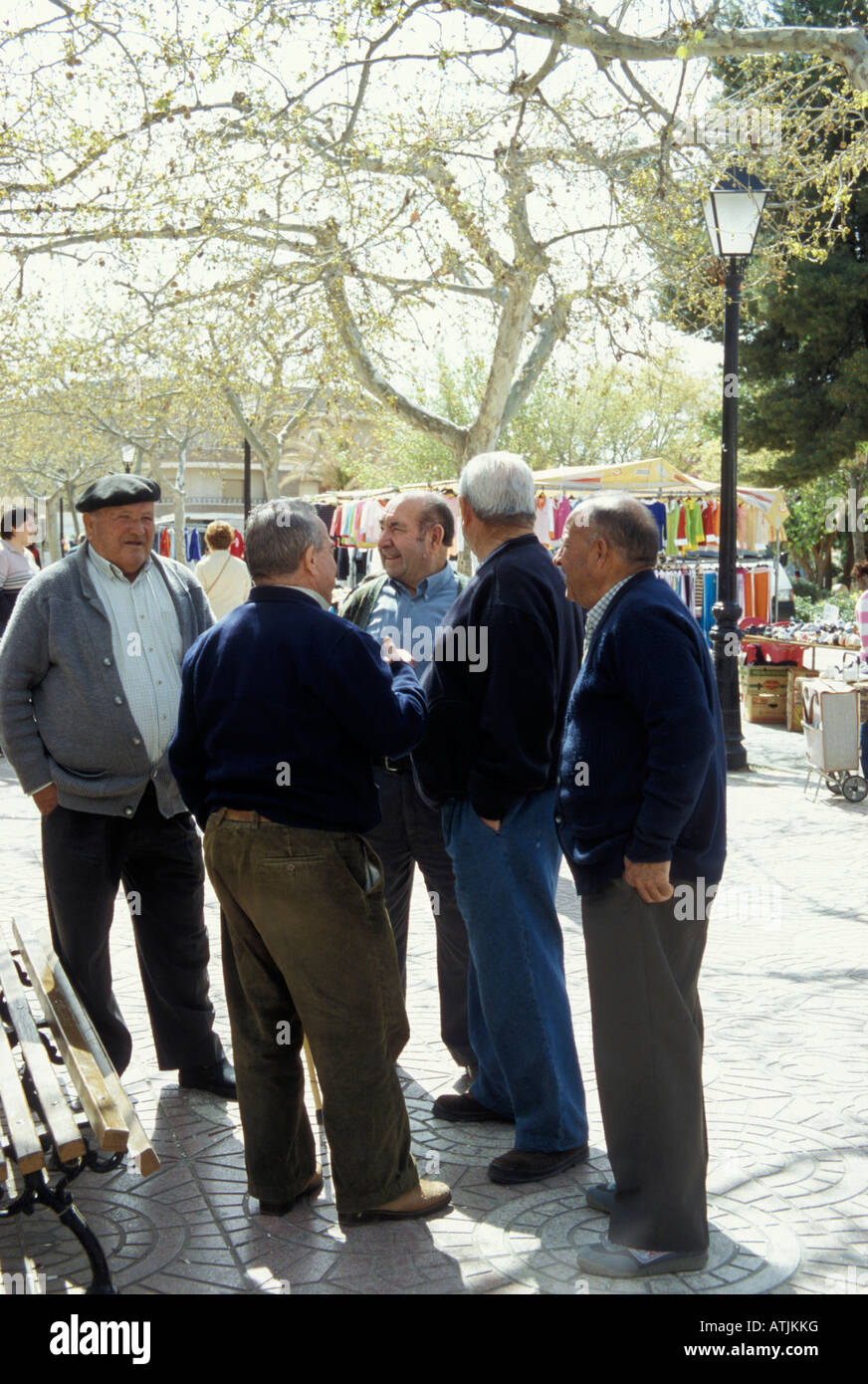 old spanish men gathering in market square Elche de la Sierra Castilla ...