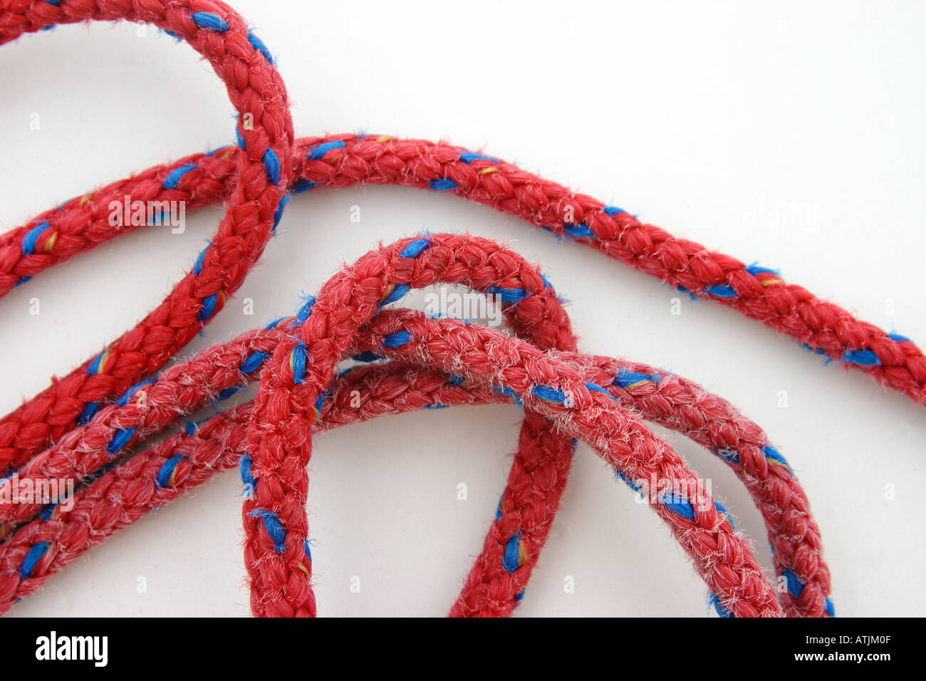 Red tangled rope Stock Photo - Alamy