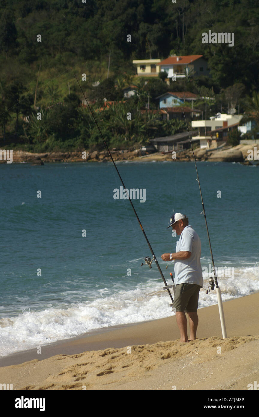 Fishing on the beach Stock Photo - Alamy