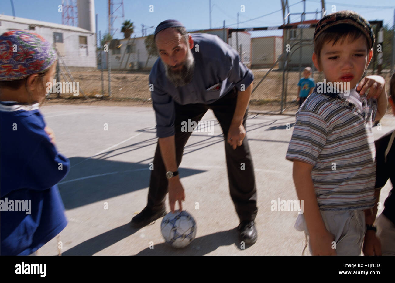 Jewish children playing football in Yericho settlement Stock Photo - Alamy