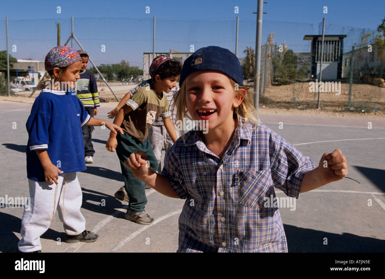 Jewish children playing football in Yericho settlement Stock Photo - Alamy