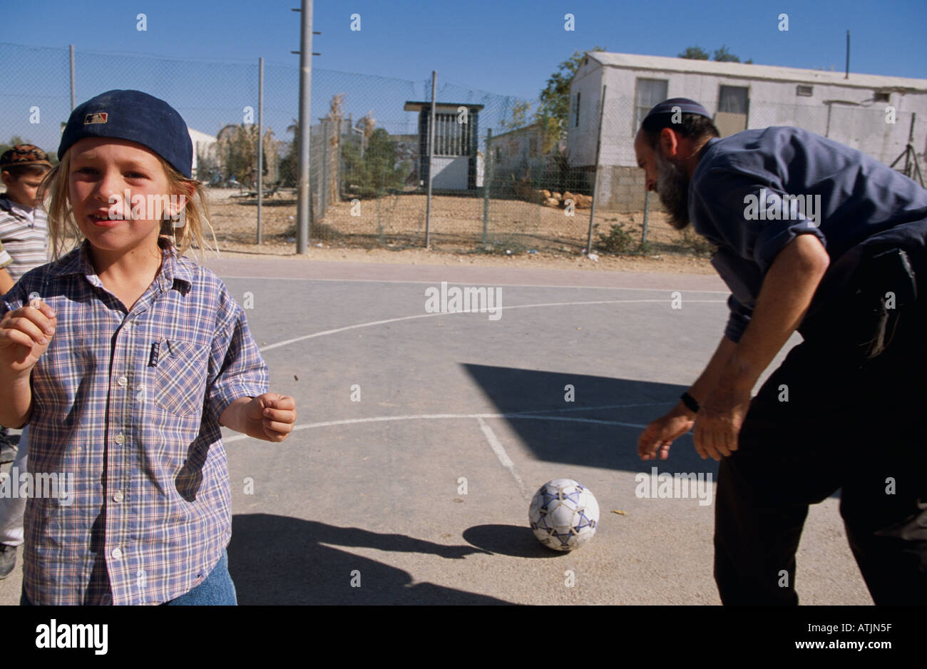Jewish children playing football in Yericho settlement Stock Photo - Alamy