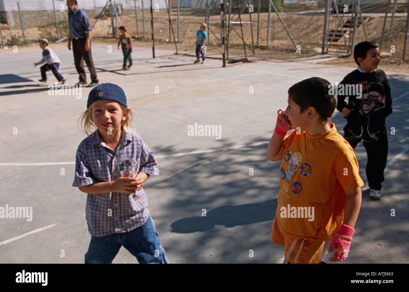 Jewish children playing football in Yericho settlement Stock Photo - Alamy