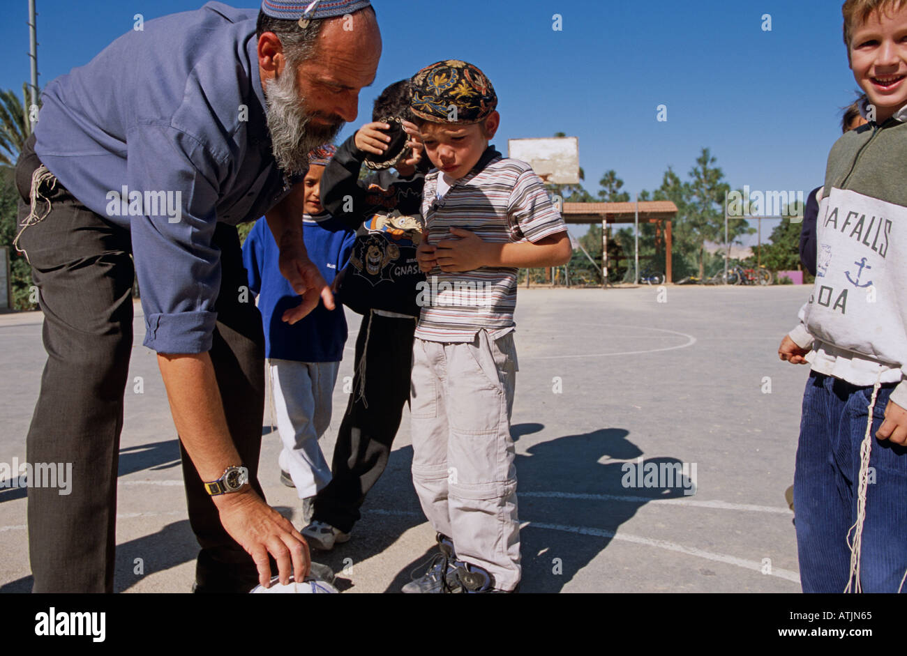 Jewish children playing football in Yericho settlement Stock Photo - Alamy