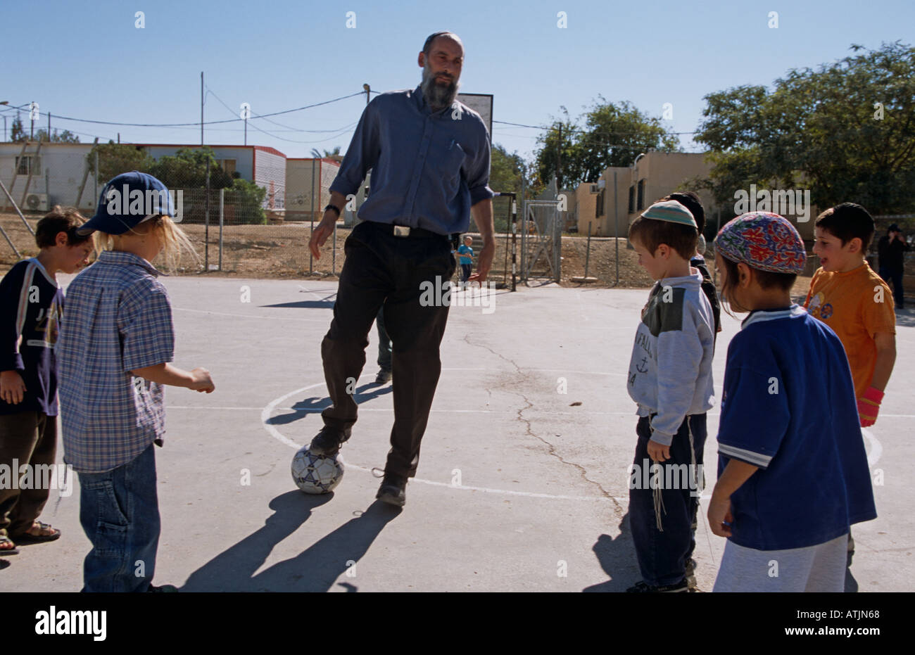 Jewish children playing football in Yericho settlement Stock Photo - Alamy