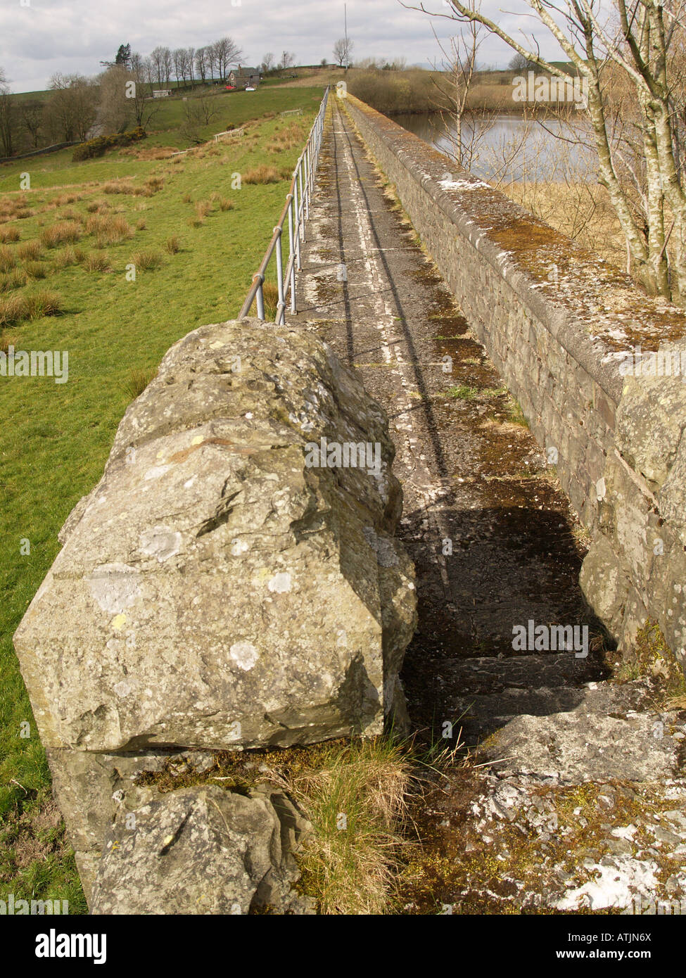 path victorian reservoir dam drystone wall rampart Stock Photo - Alamy