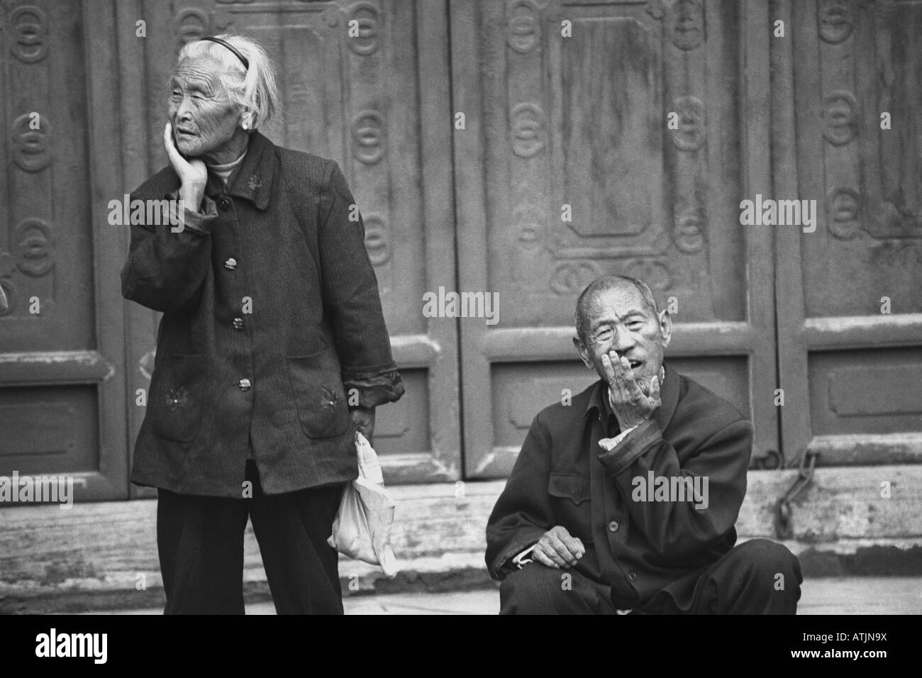 An old Chinese couple watches the Shaolin monks perform in Henan China ...