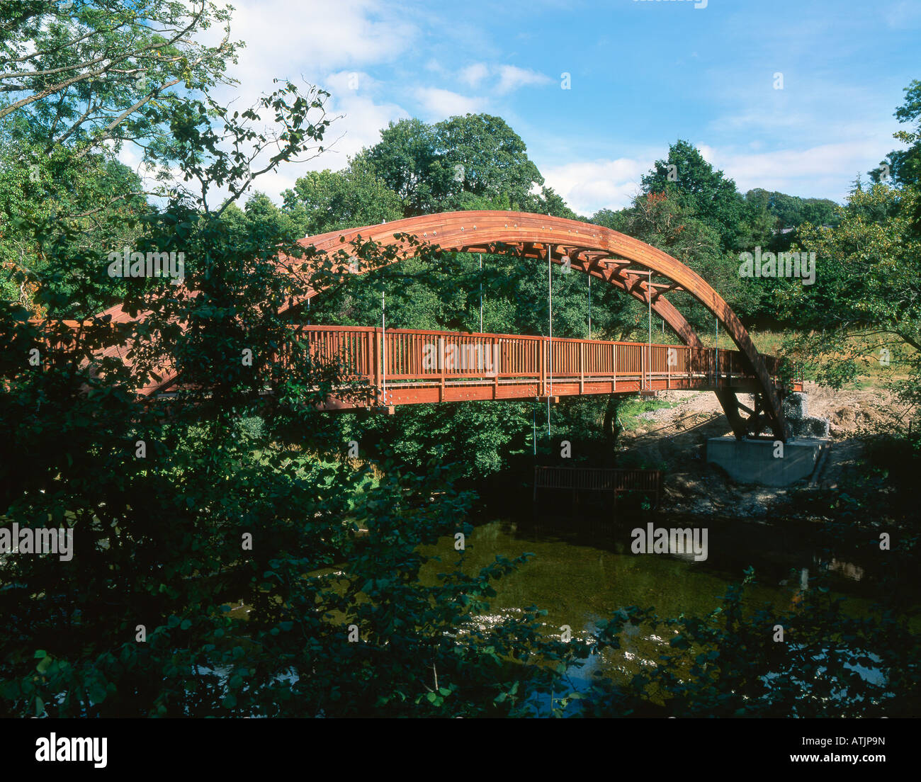 Wooden arch footbridge, Wales, UK Stock Photo - Alamy