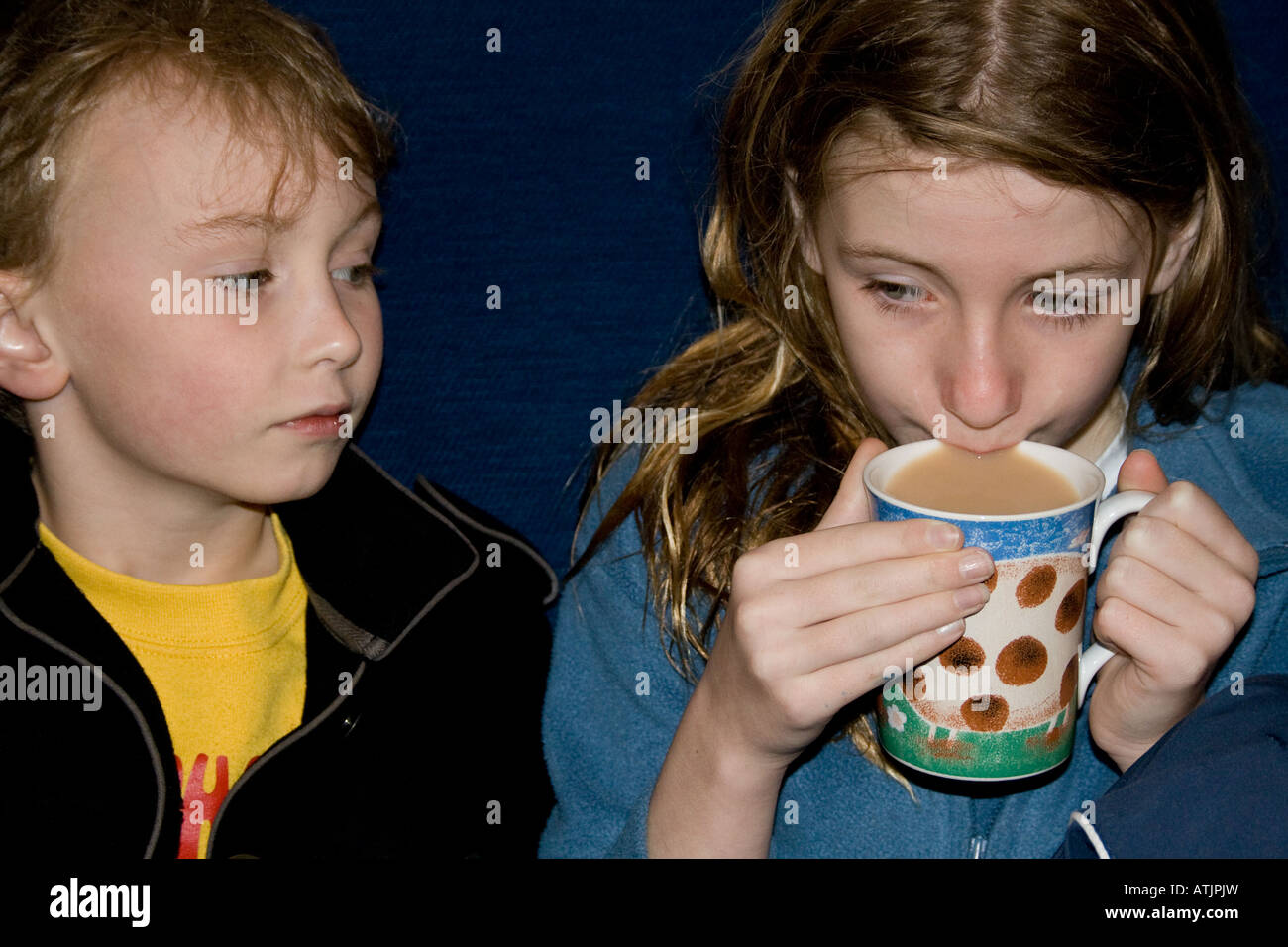 Envy over a cup of tea Stock Photo - Alamy