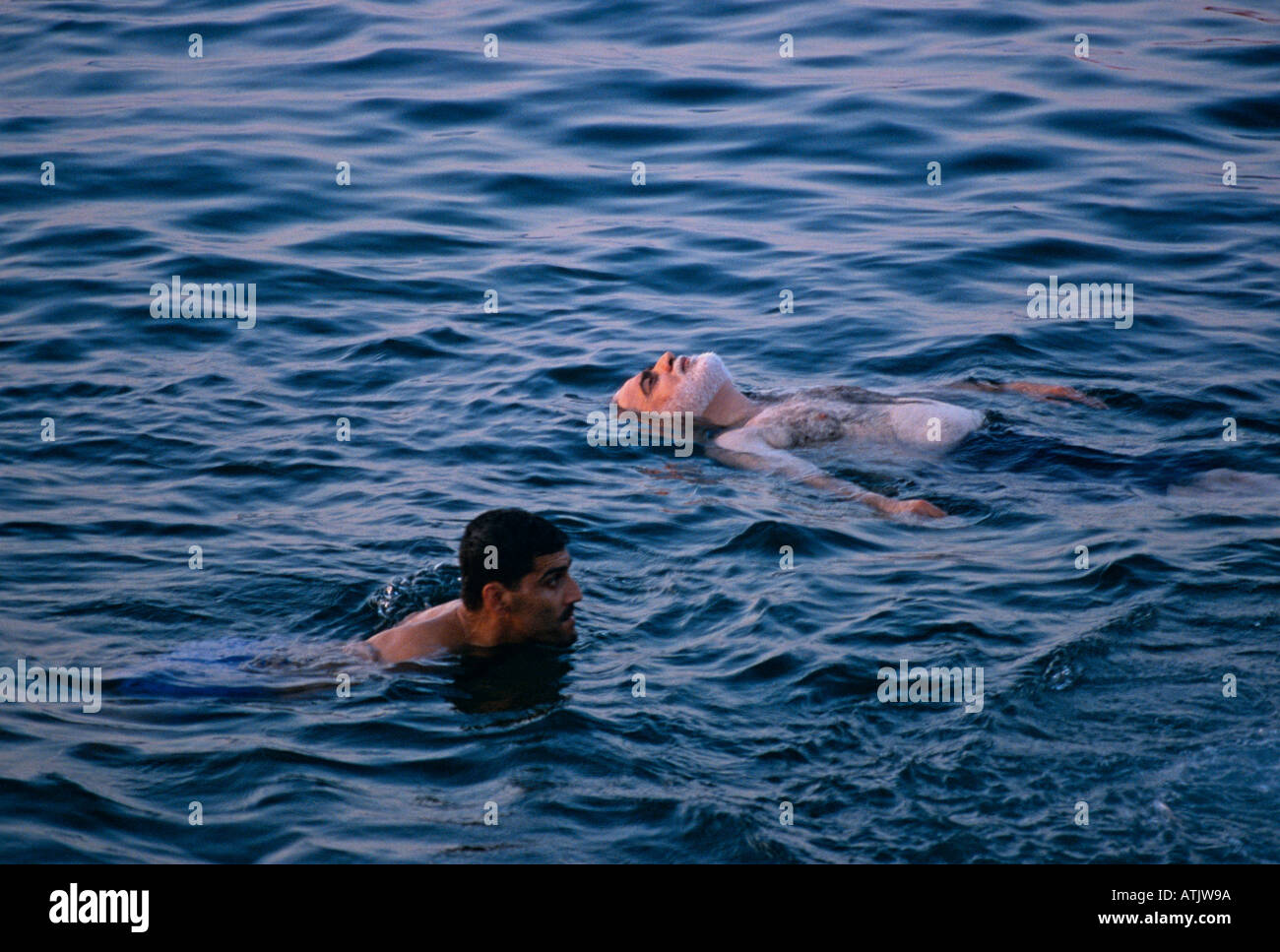 Two men relaxing in waters. Beirut, Lebanon Stock Photo - Alamy