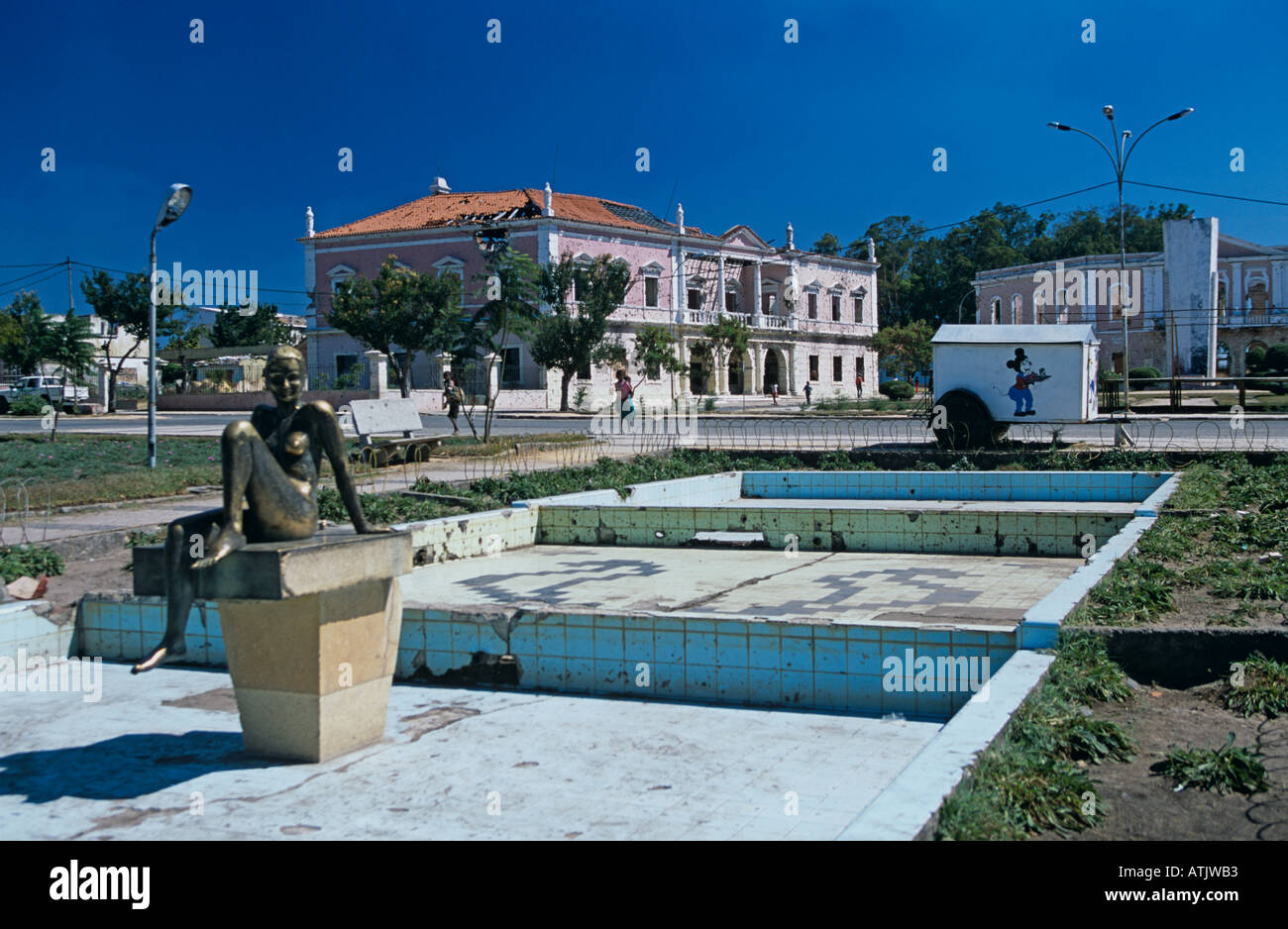 Scene of abandoned pool with statue. Saurimo, Angola Stock Photo - Alamy