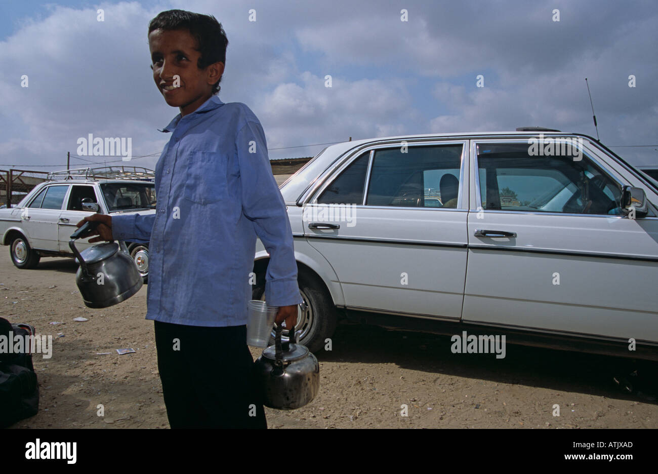 Palestinian boy selling tea on roadside, Palestine Stock Photo - Alamy