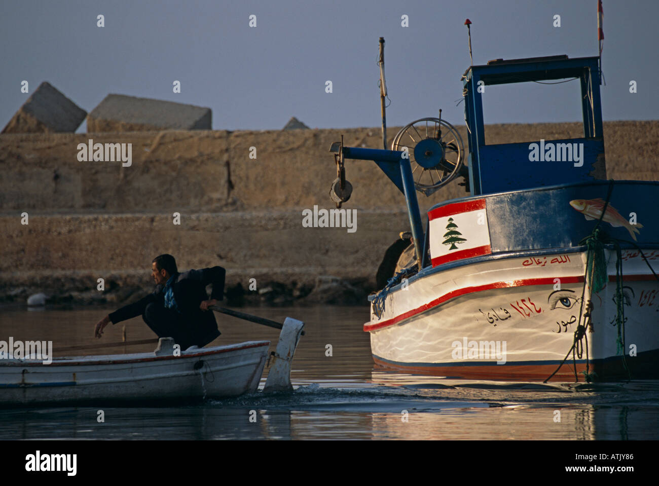 Fisherman and fishing boats in the coastal city of Saida, Lebanon Stock ...