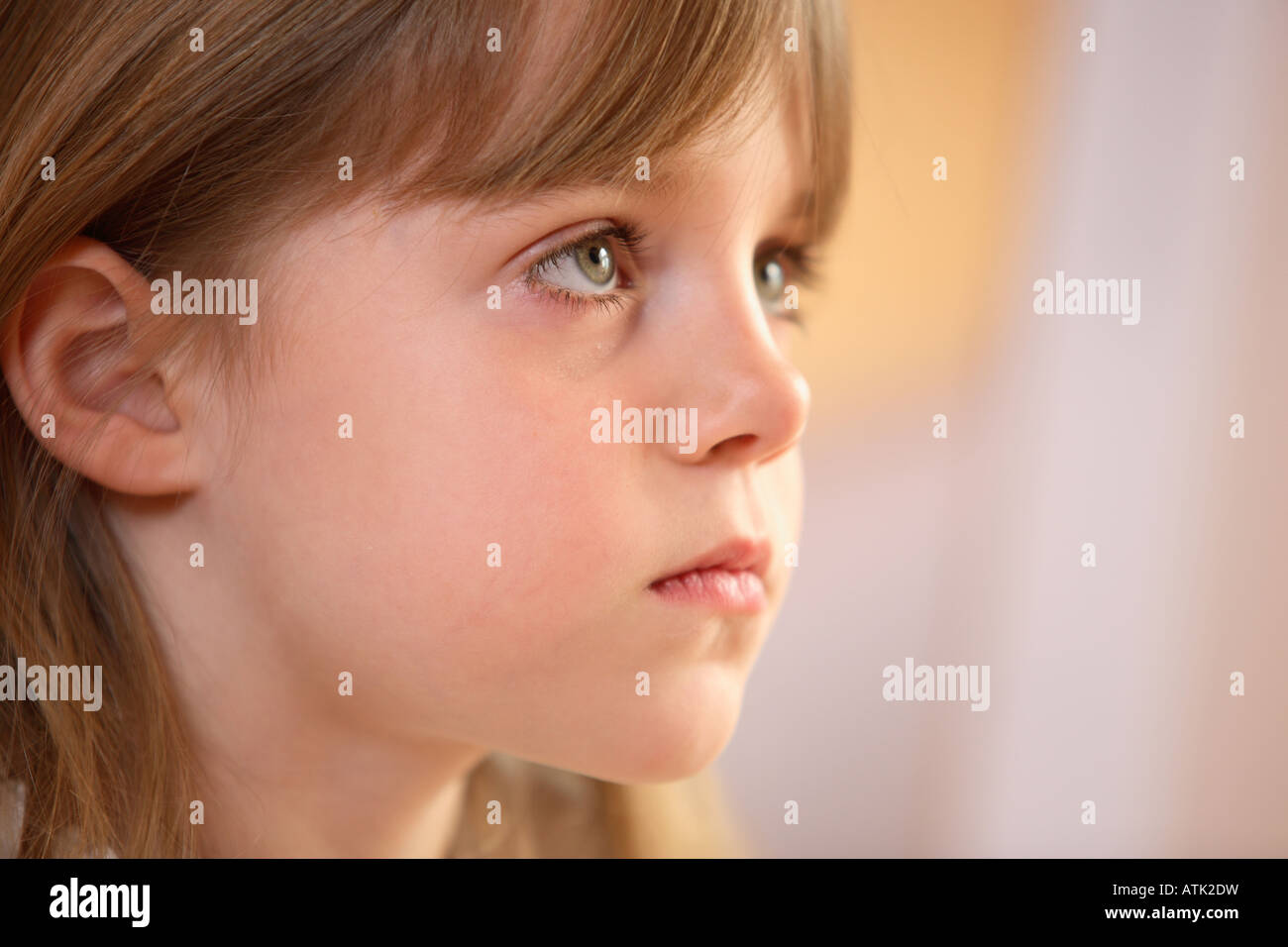 Close-up of child's face, concentrating Stock Photo - Alamy