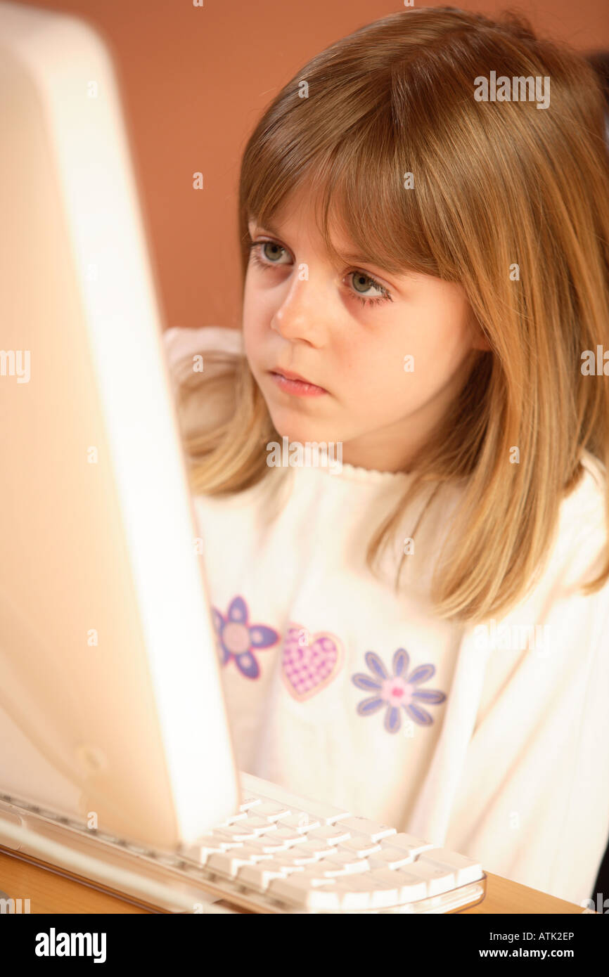 Child working at a computer Stock Photo - Alamy