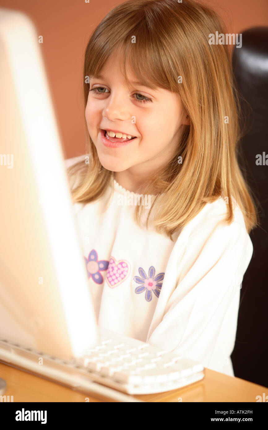 Child working at a computer Stock Photo - Alamy
