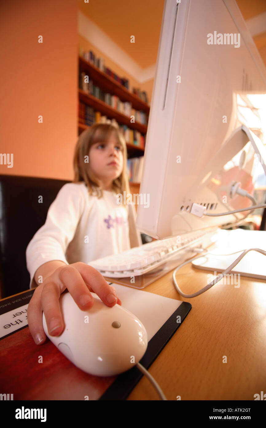 A child working at a computer Stock Photo - Alamy