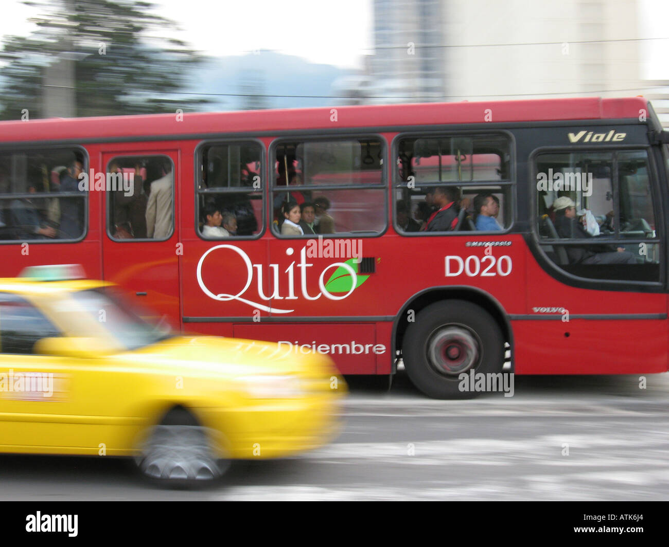 Red bus and yellow taxi in Quito Ecuador South America Stock Photo - Alamy