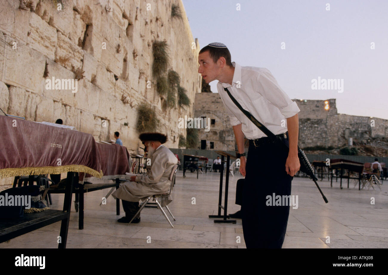 A soldier bowing to the Western Wall Stock Photo - Alamy