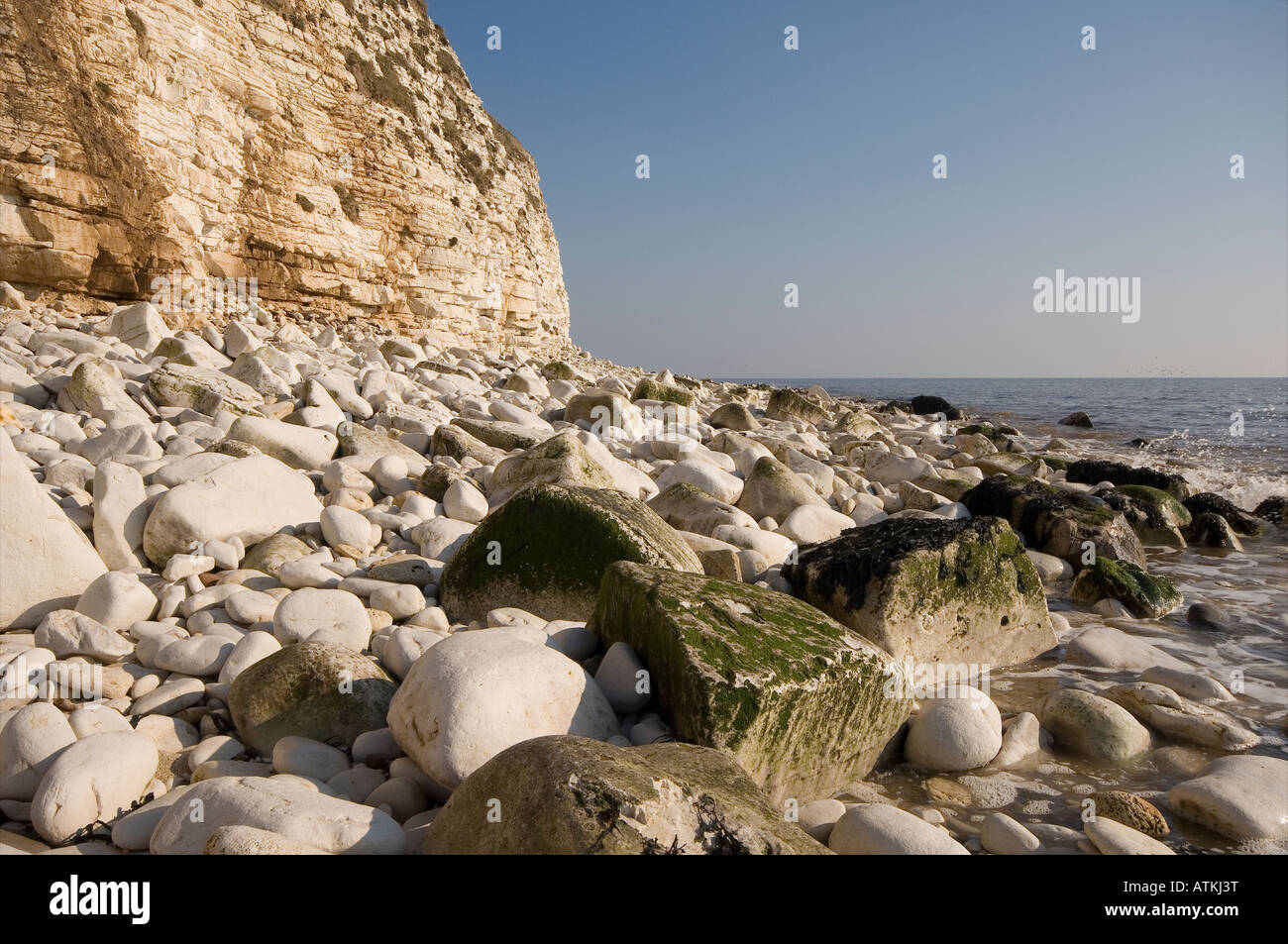 Rocks pebbles on beach South Landing Flamborough East Yorkshire England ...