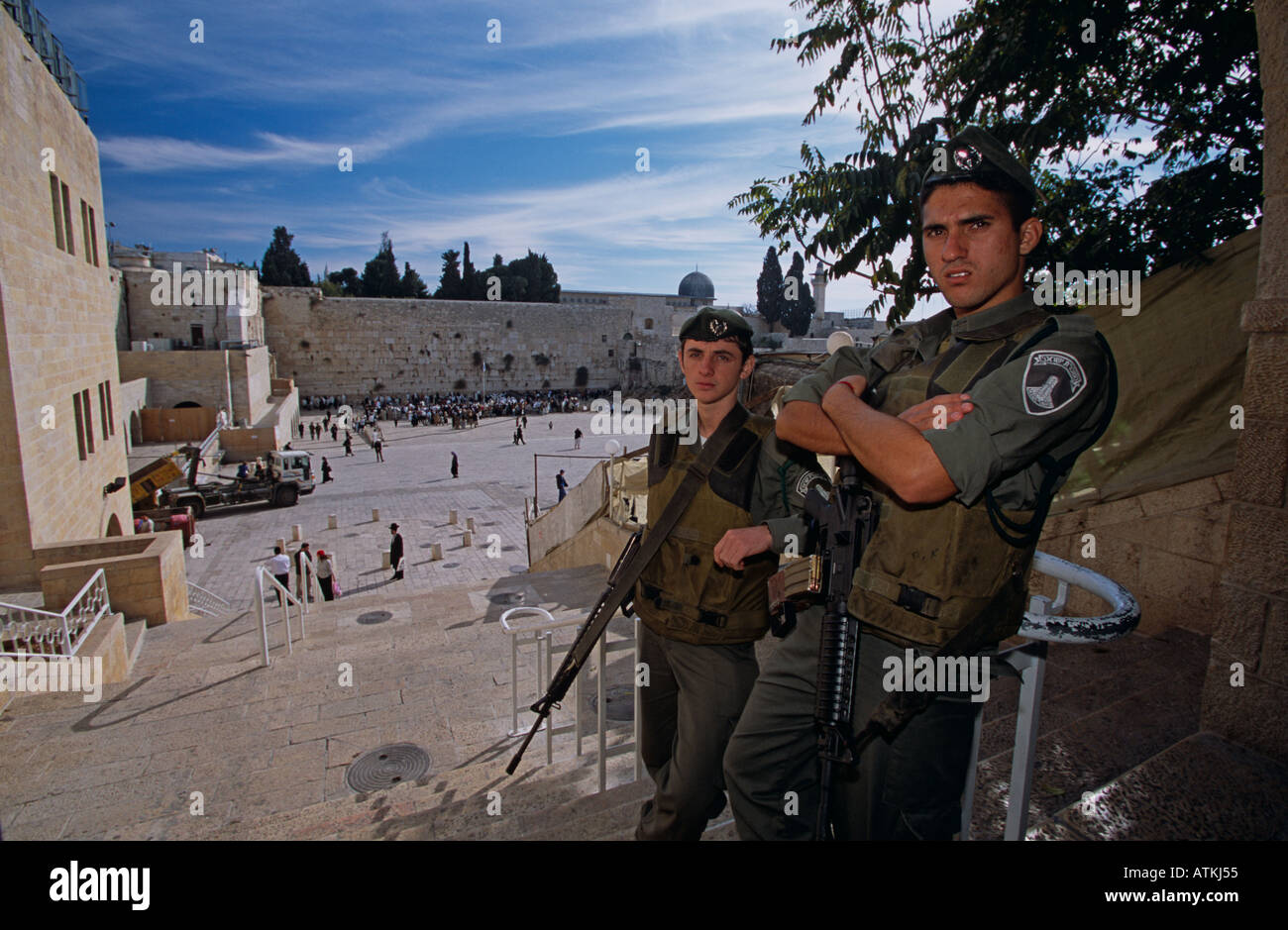 Israeli soldiers standing guard on stairs overlooking Wailing Wall ...
