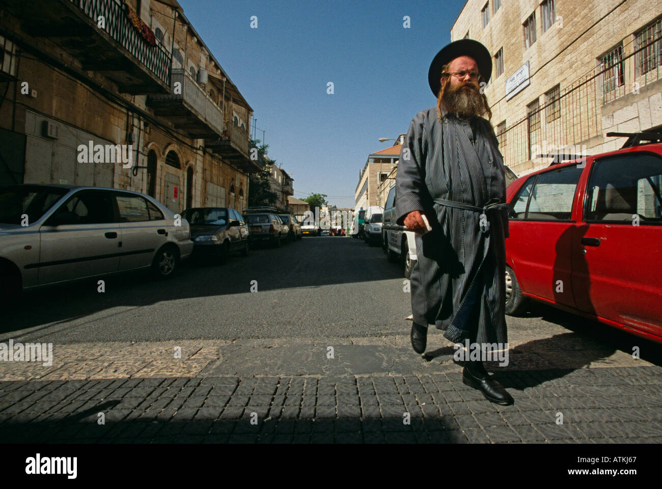 A Jewish man walking along the street of Jerusalem Stock Photo - Alamy